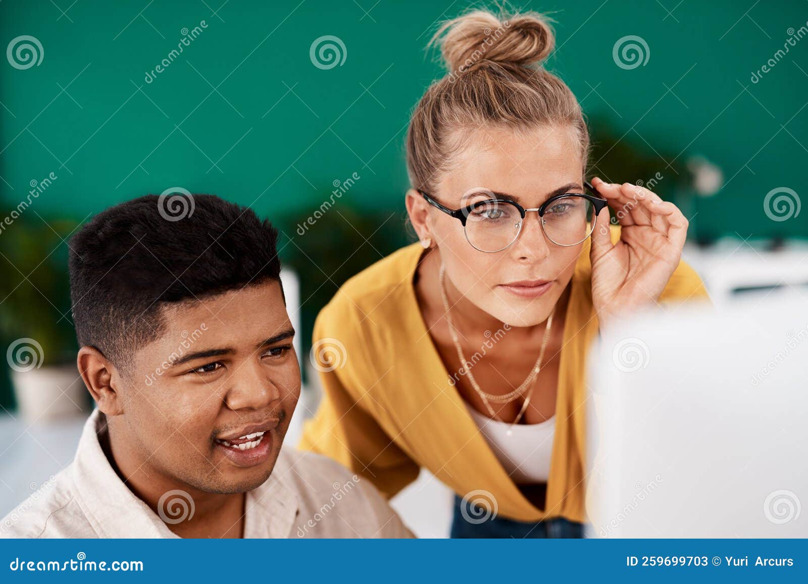 Working Closely Together To Perfect the Final Result. Two Young ...