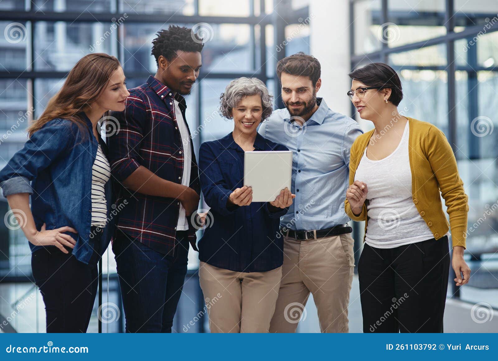 Working Cohesively Together. a Group of Creatives Working Together on a ...