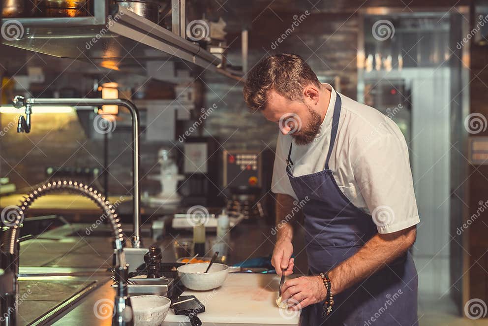 Working cook indoors stock image. Image of ingredient - 108691487