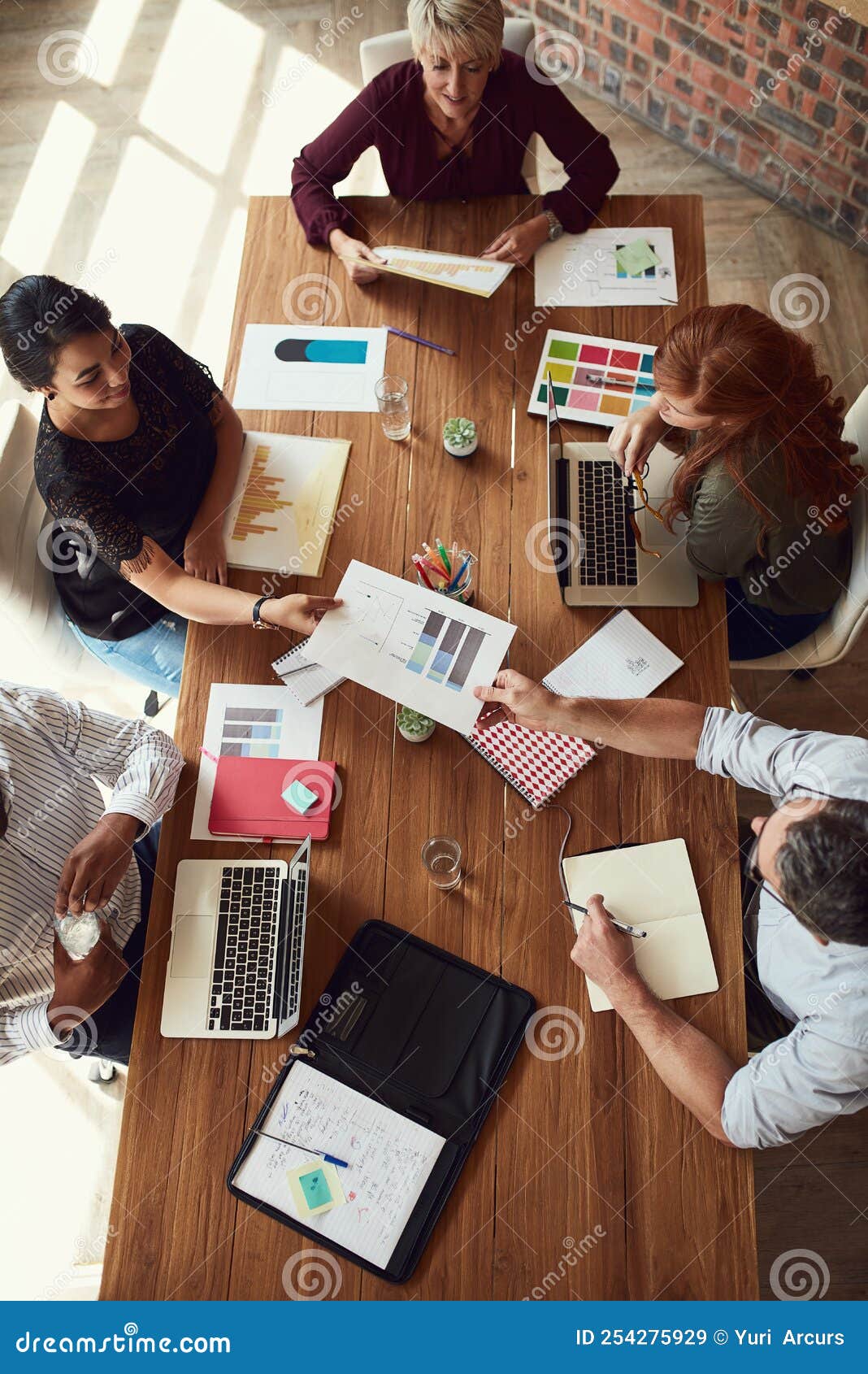 Working in a Cooperative Environment. High Angle Shot of a Group of ...