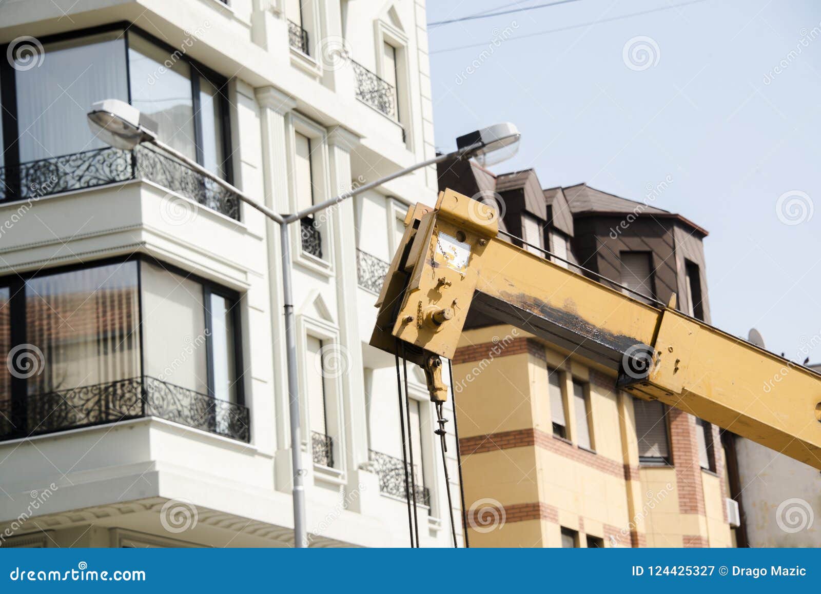 Working with a Crane and Lifting Pipes on the Building Stock Image ...
