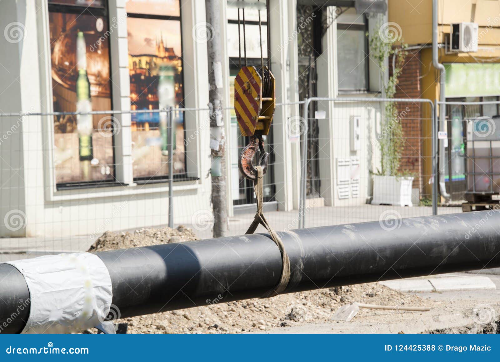 Working with a Crane and Lifting Pipes on the Building Stock Photo ...