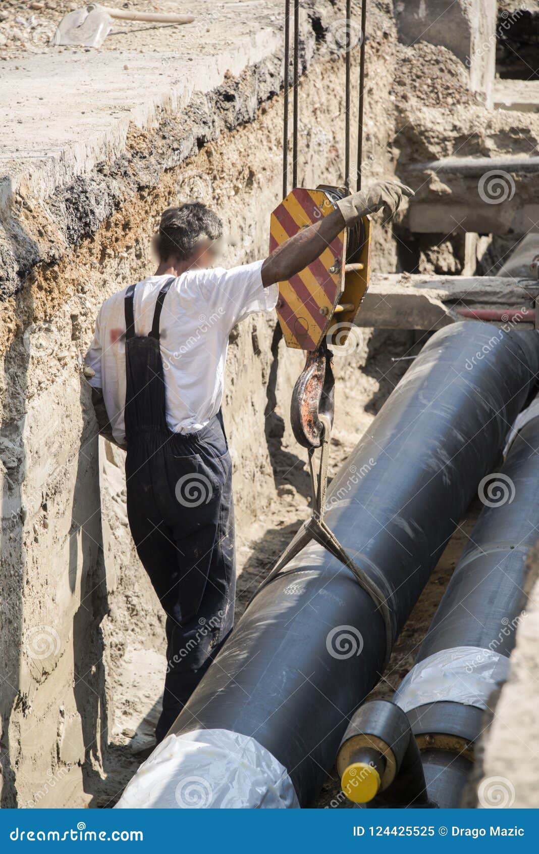 Working with a Crane and Lifting Pipes on the Building Stock Image ...