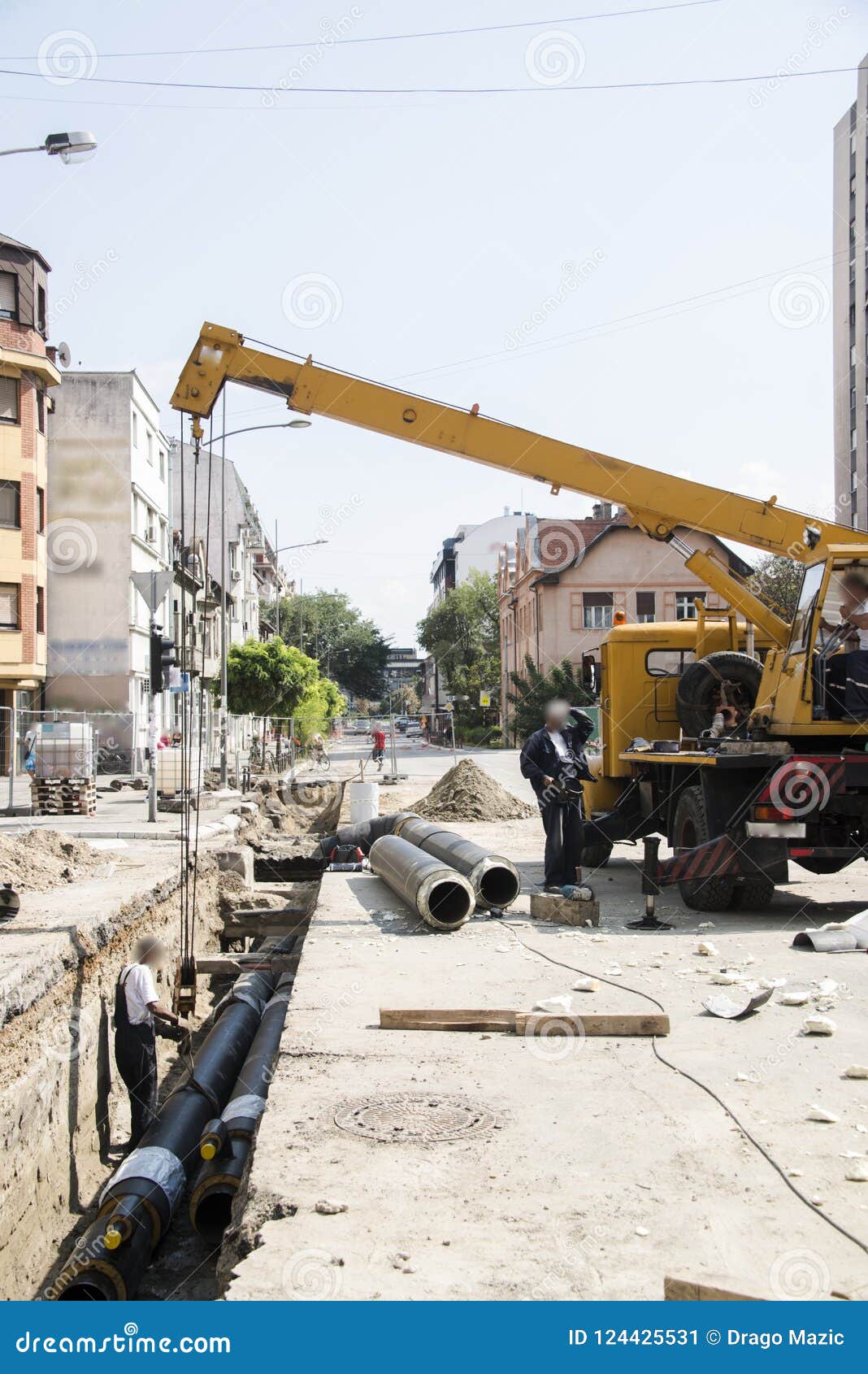 Working with a Crane and Lifting Pipes on the Building Stock Image ...