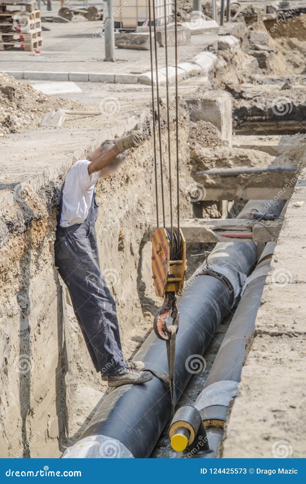 Working with a Crane and Lifting Pipes on the Building Stock Image ...