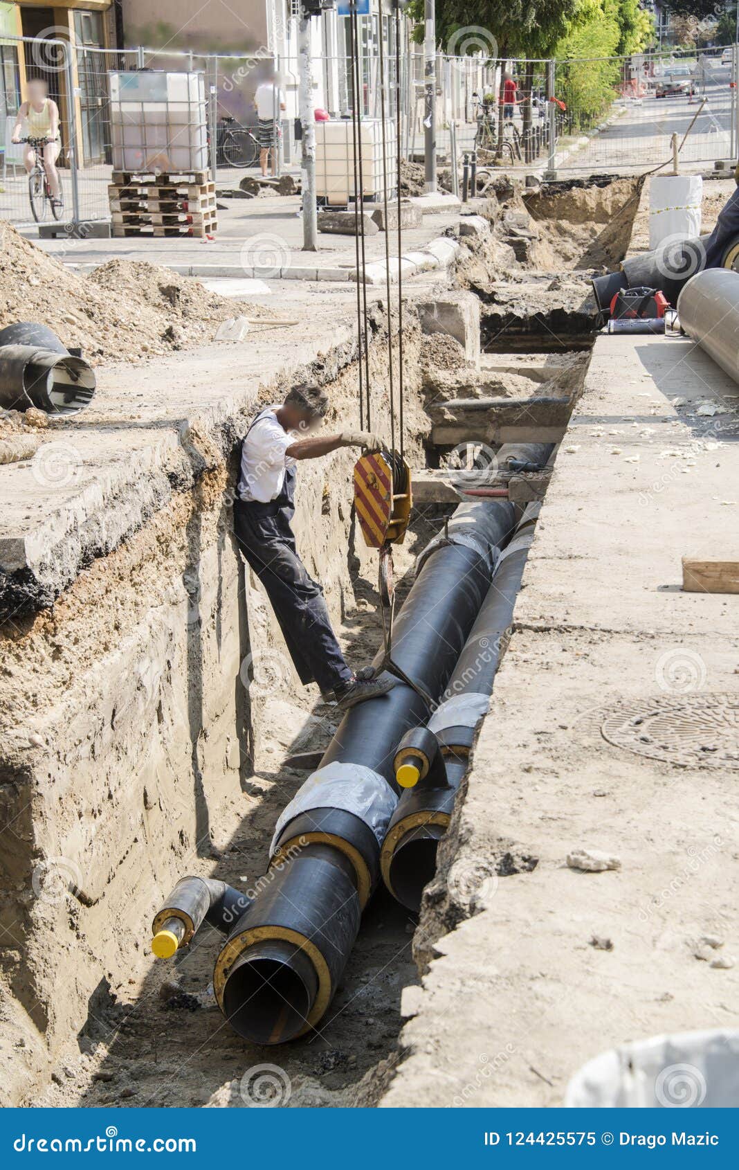 Working with a Crane and Lifting Pipes on the Building Stock Image ...