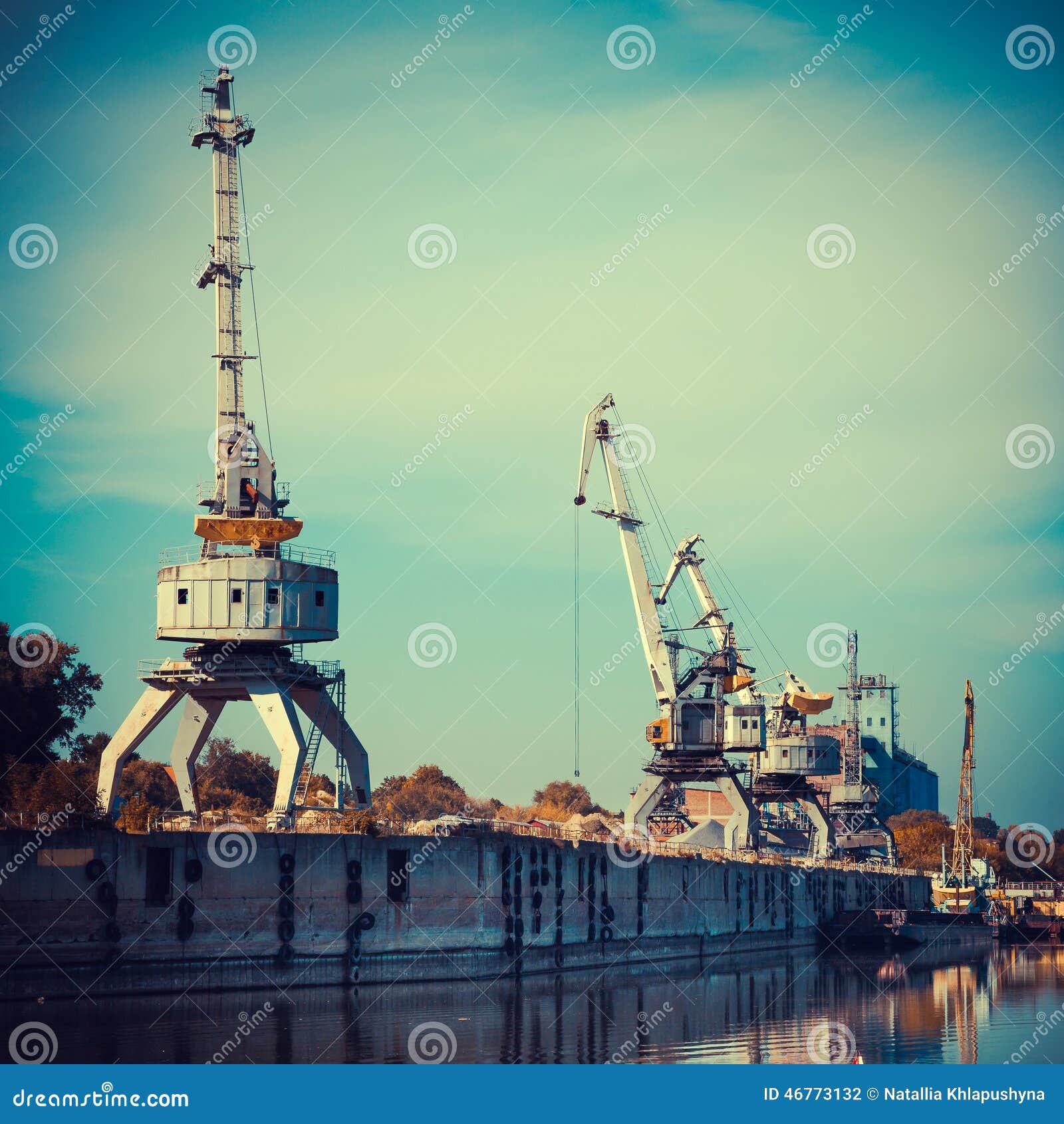 Working Cranes for Cargo at the Shipyard Docks in River Port. Stock ...
