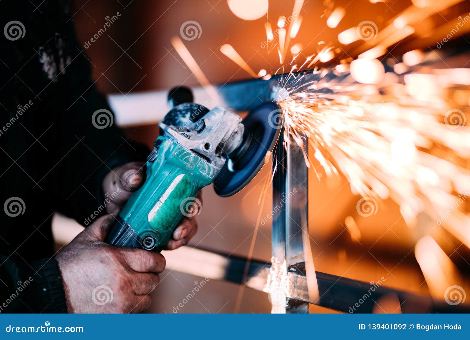 Man Using Angle Grinder In Factory And Throwing Sparks Royalty-Free ...