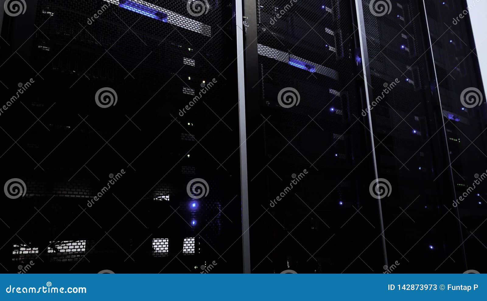 Working Data Center with Rows of Rack Servers. Blue Light. Dark Server ...