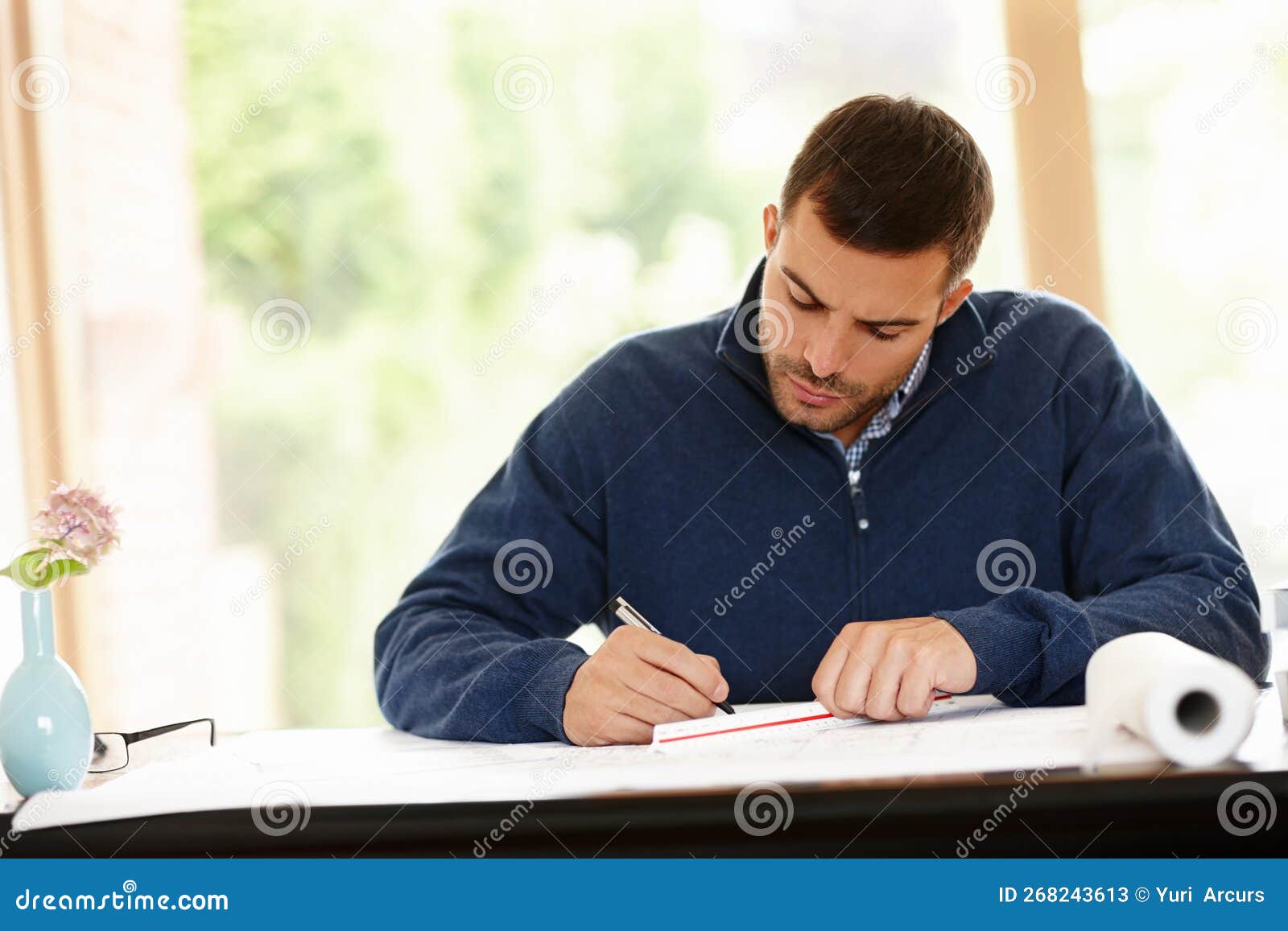 Working on the Design of His Dreams. a Young Man Drawing Up Plans at ...