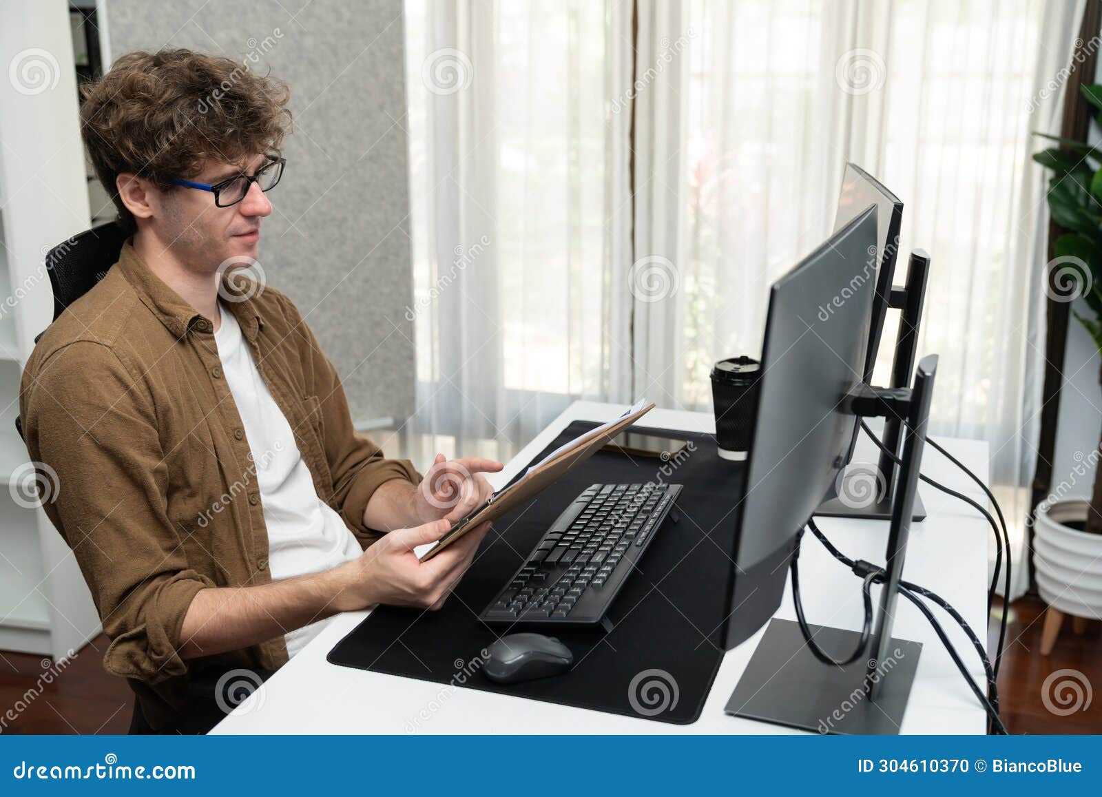 It Developer Reading Online Software Development on Document Report. Gusher. Stock Photo - Image ...