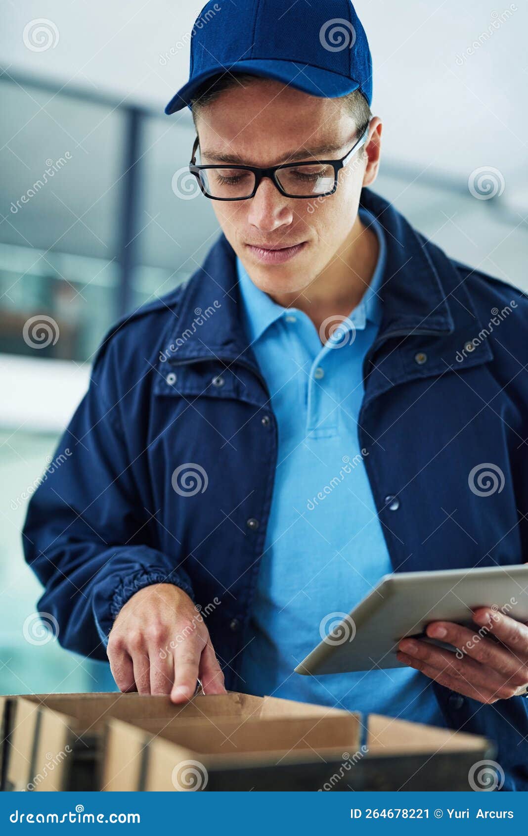 Working with a Digitized System. a Courier Using a Digital Tablet while ...