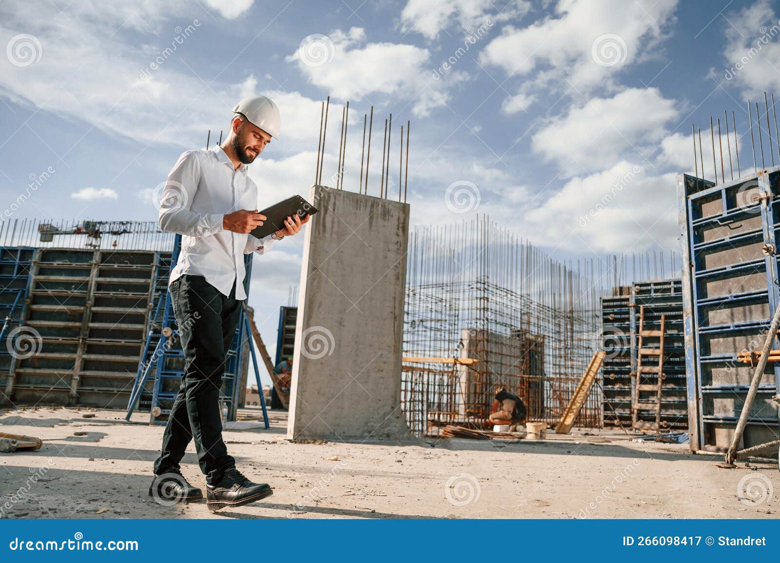 Working with Document. Man in Uniform is on the Construction Site Stock ...