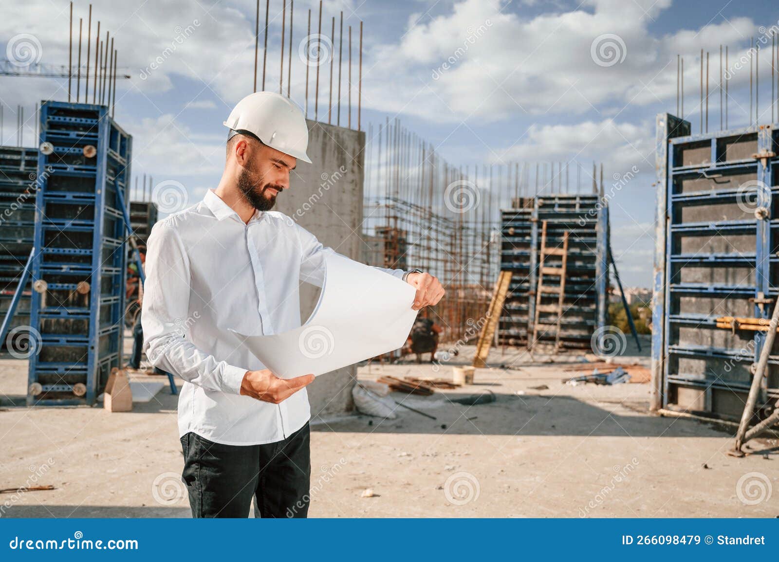 Working with Document. Man in Uniform is on the Construction Site Stock ...