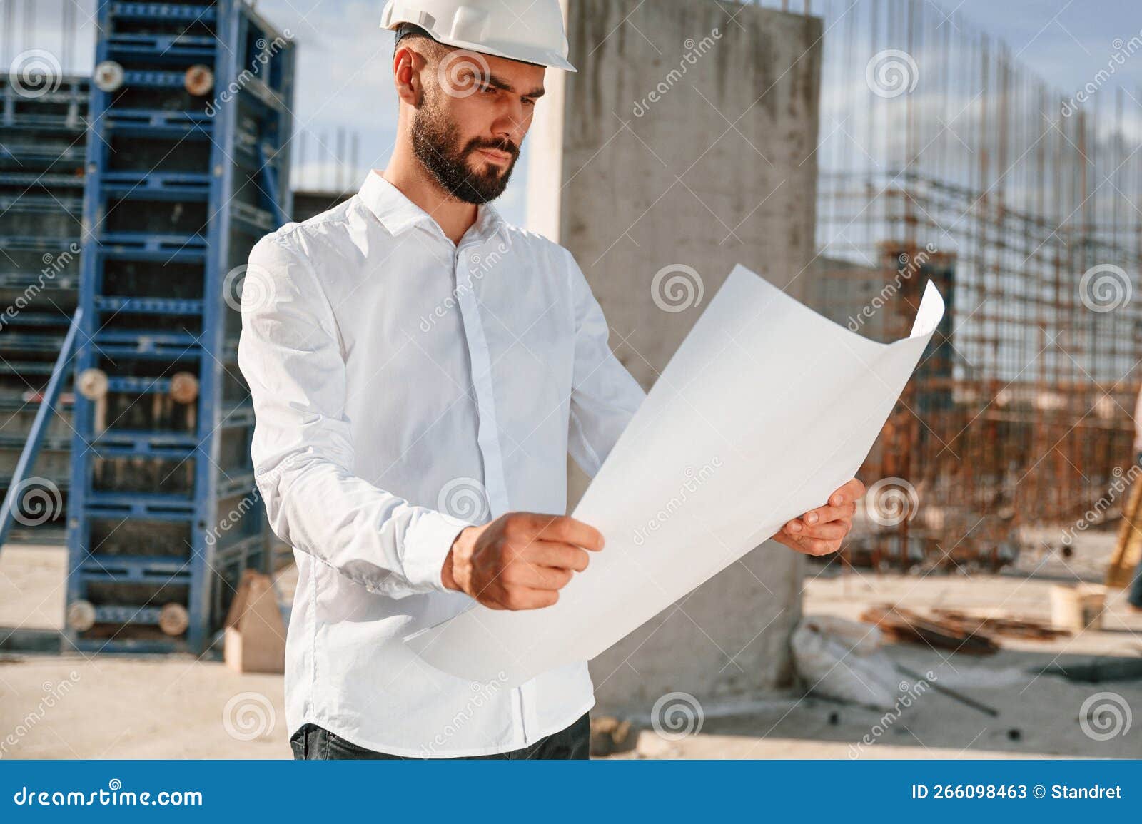 Working with Document. Man in Uniform is on the Construction Site Stock ...