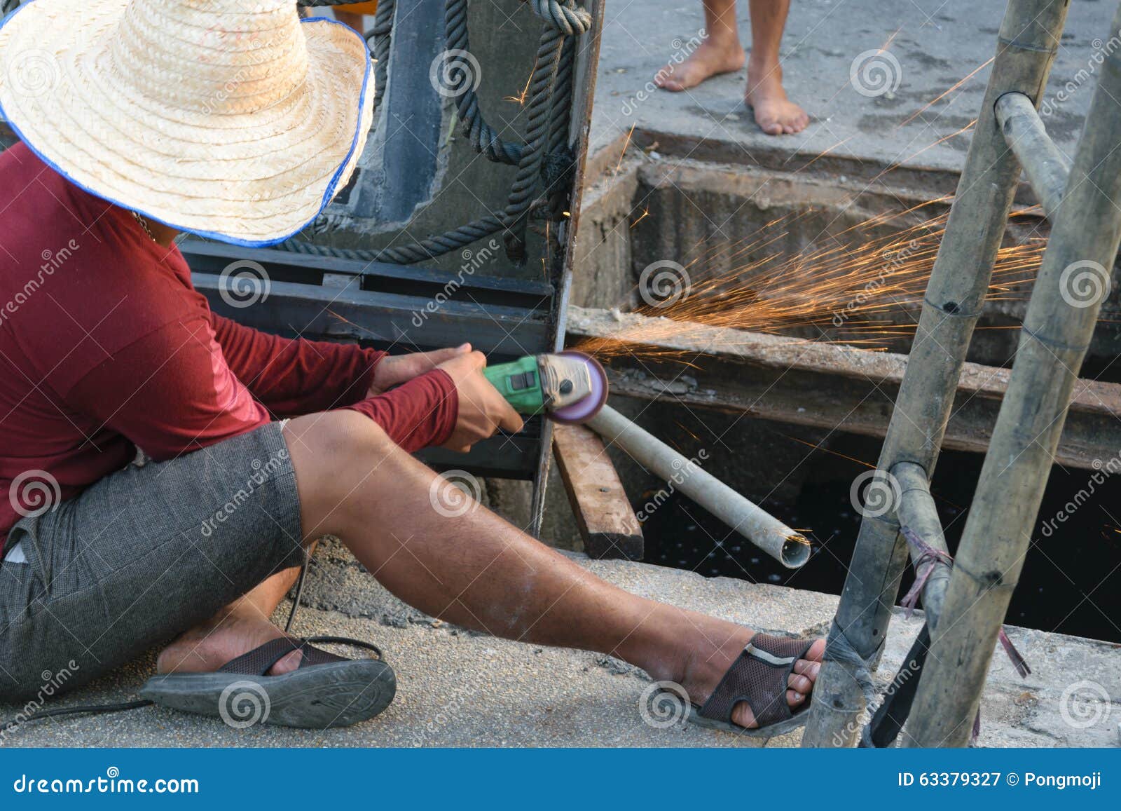 Working for drain cleaning editorial photography. Image of manhole ...