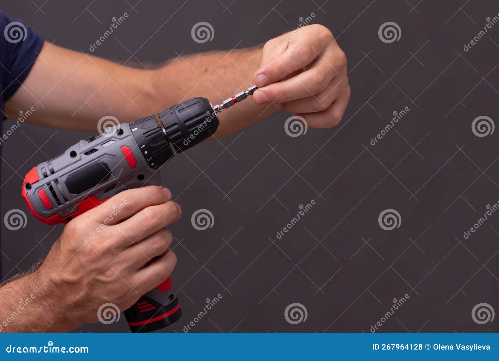 Working on an Electric Screwdriver on a Black Background Stock Photo ...