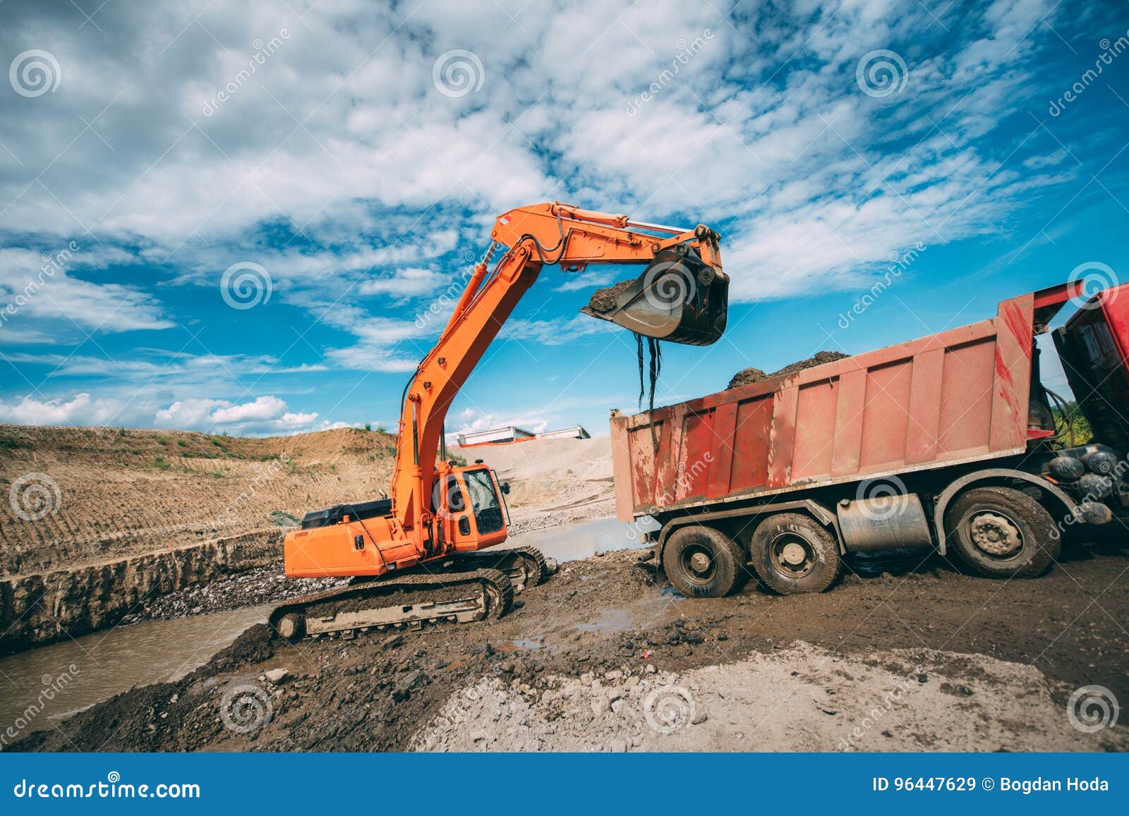 Working Excavator on Site, Loading Dumper Truck during Earthmoving ...