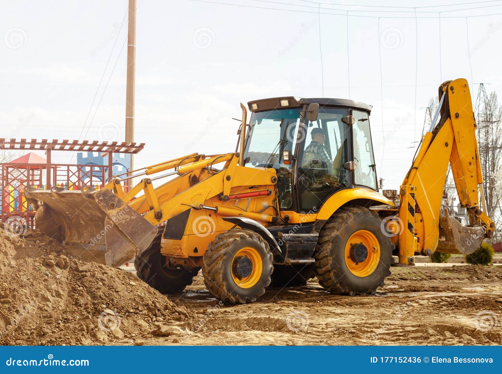 Working Excavator Tractor Digging a Trench at Construction Site ...