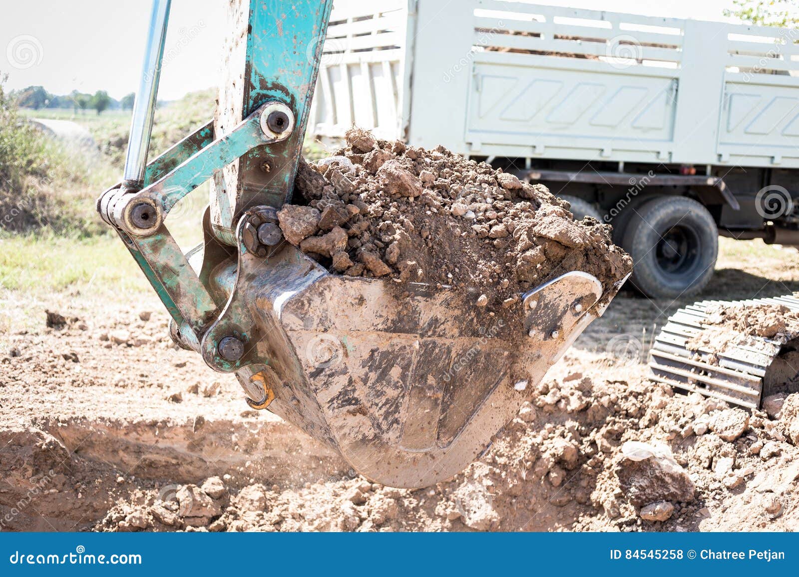 Working Excavator Tractor Digging a Trench. Stock Photo - Image of ...