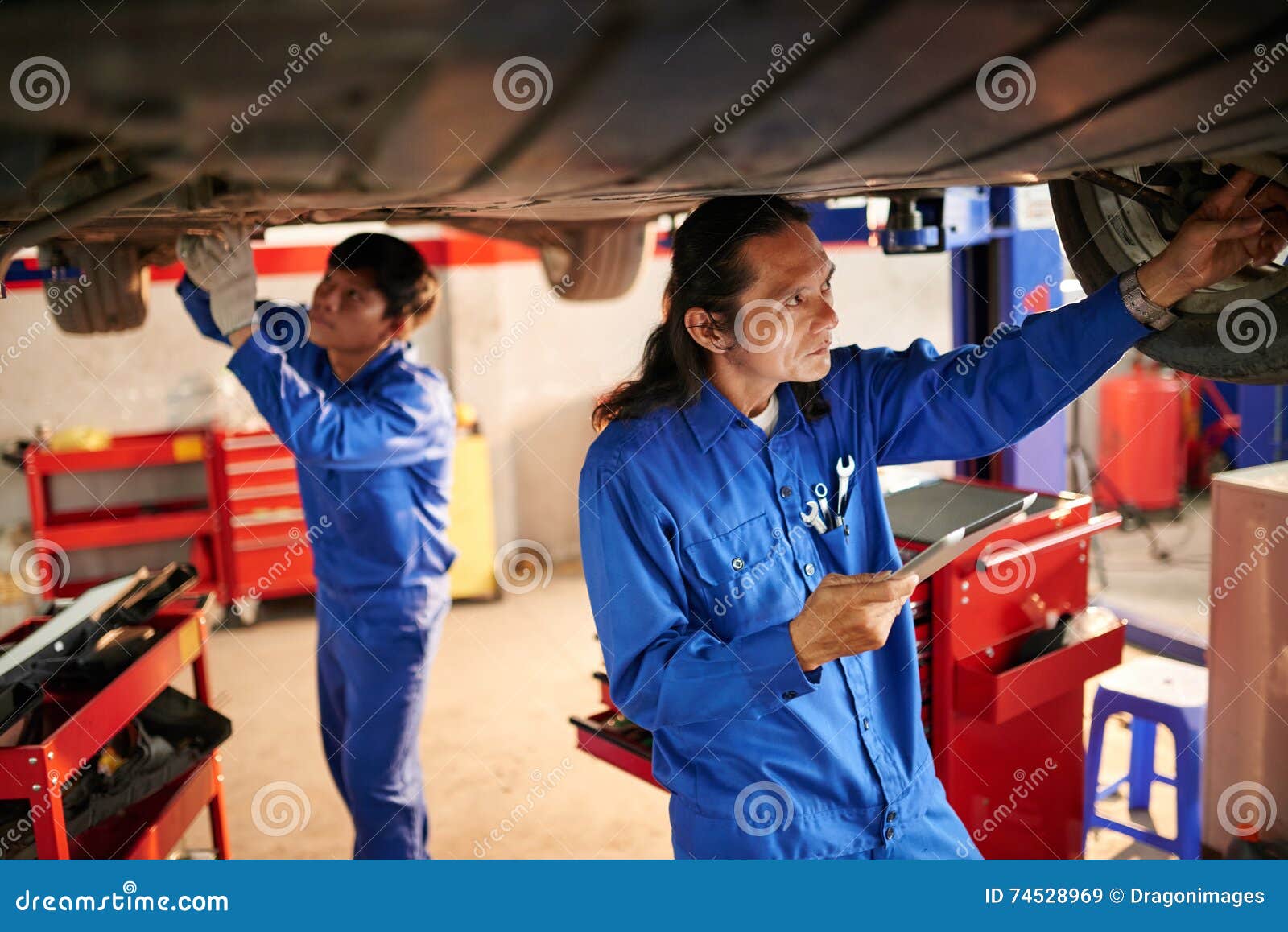 Working in garage stock image. Image of people, auto - 74528969