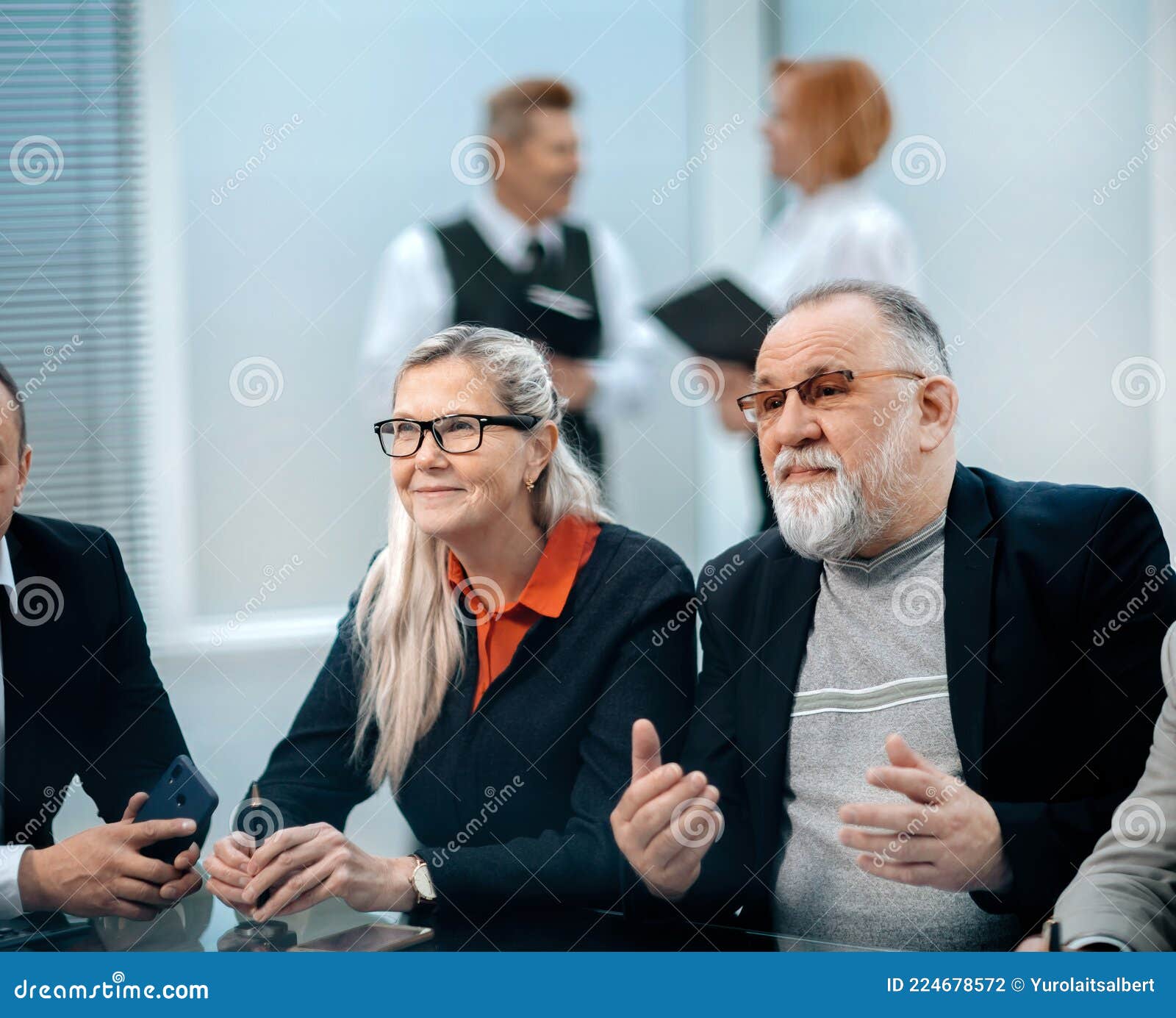 Working Group Sitting at a Table in the Conference Room. Stock Photo ...