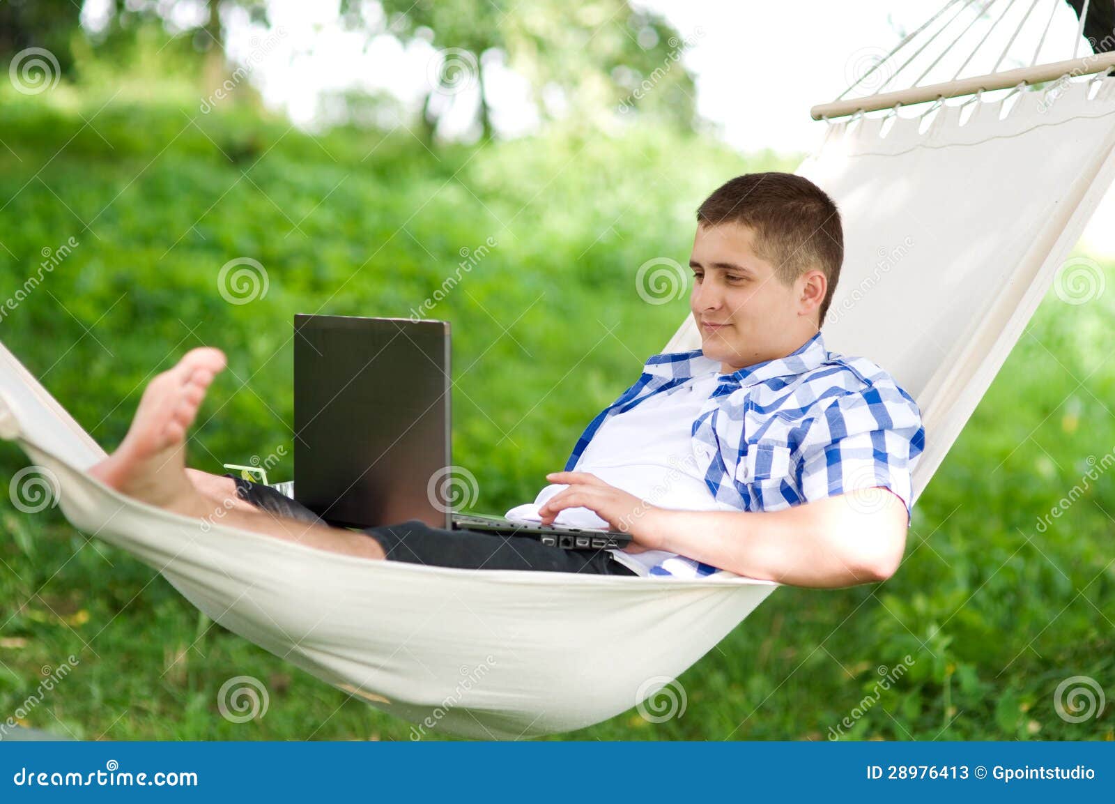 Working on hammock stock image. Image of contemporary - 28976413