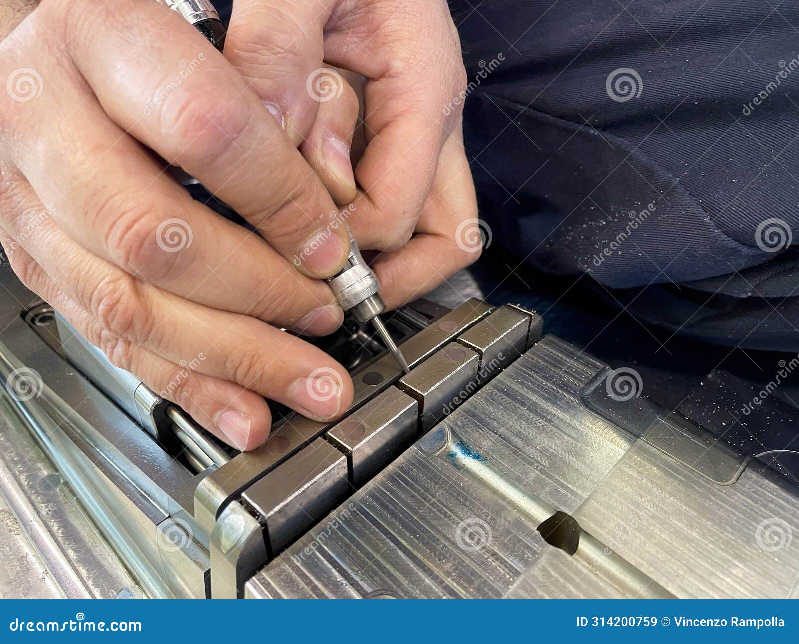 Working Hands, Finishing with a Precision Tool on a Steel Mould Stock ...