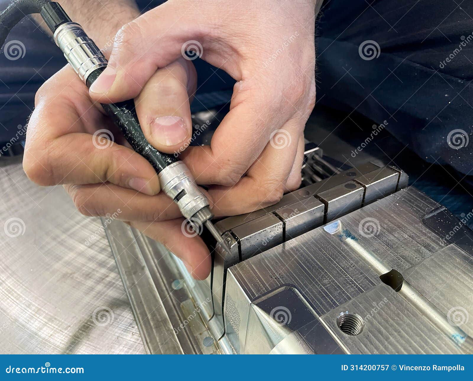 Working Hands, Finishing with a Precision Tool on a Steel Mould Stock ...