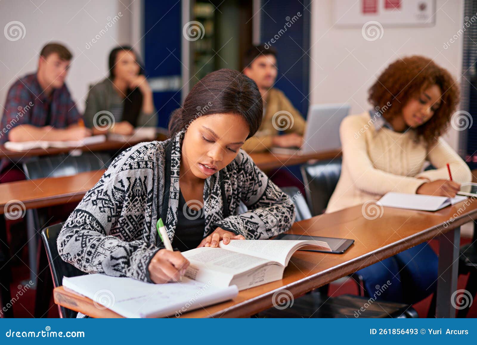 Working Hard for a Bright Future. Students Working Diligently in Class ...