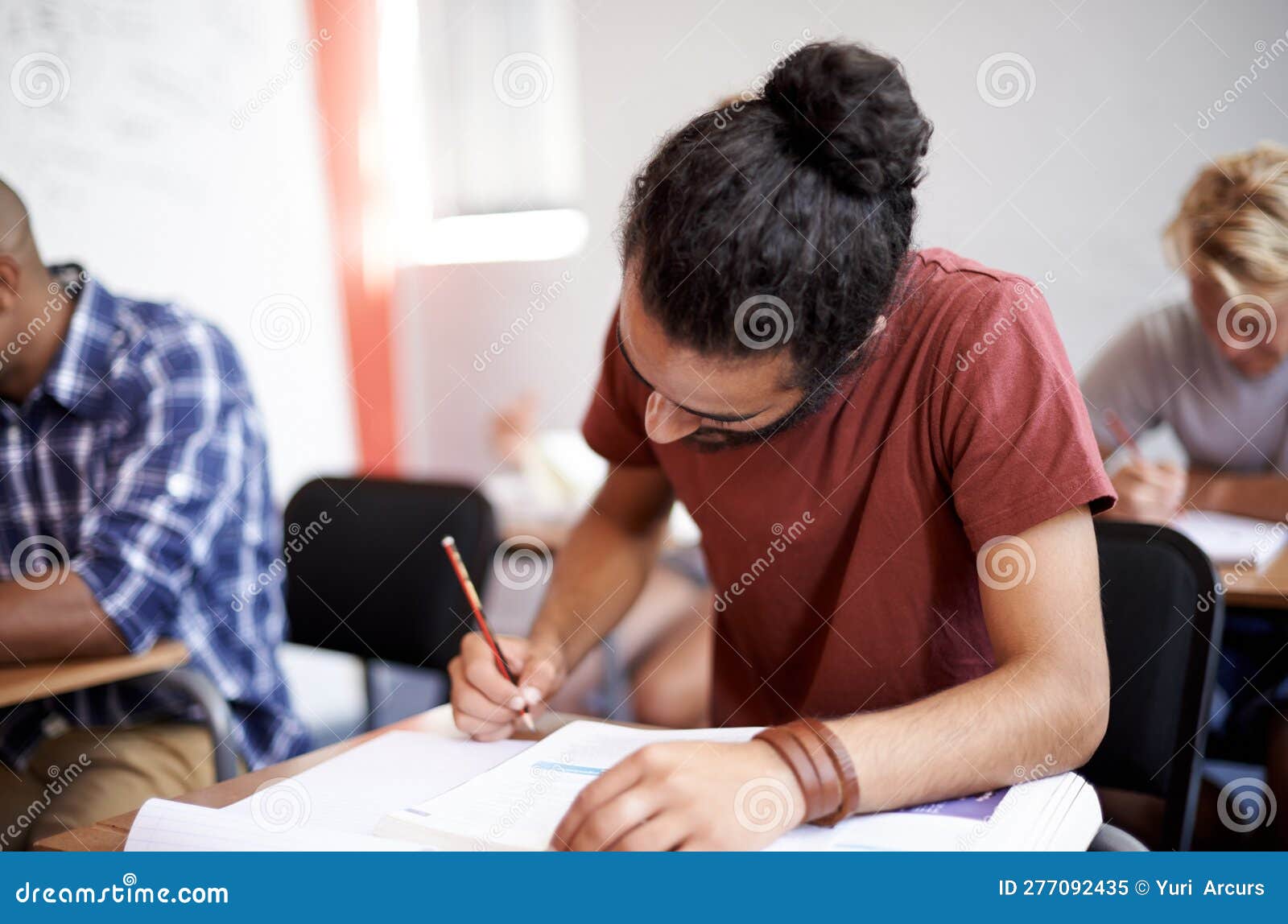 Working Hard for Good Grades. Young University Students during Class ...