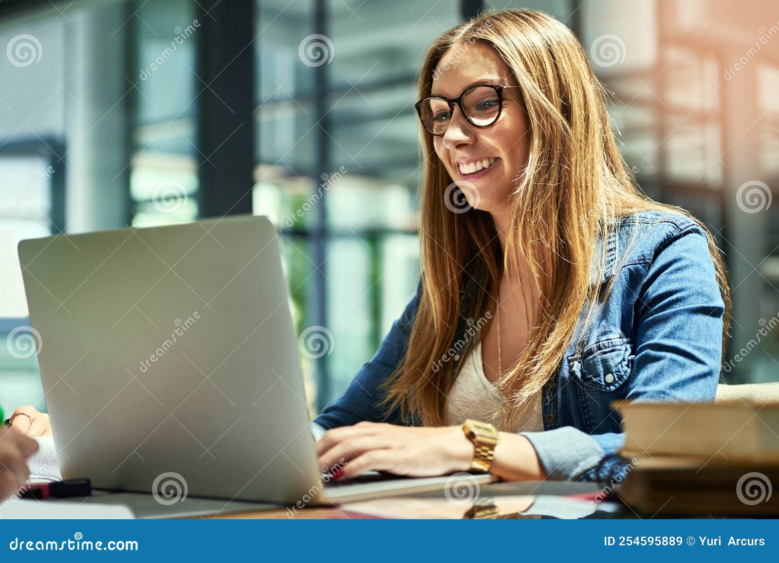 Working Hard for Great Grades. a Smiling Female University Student ...