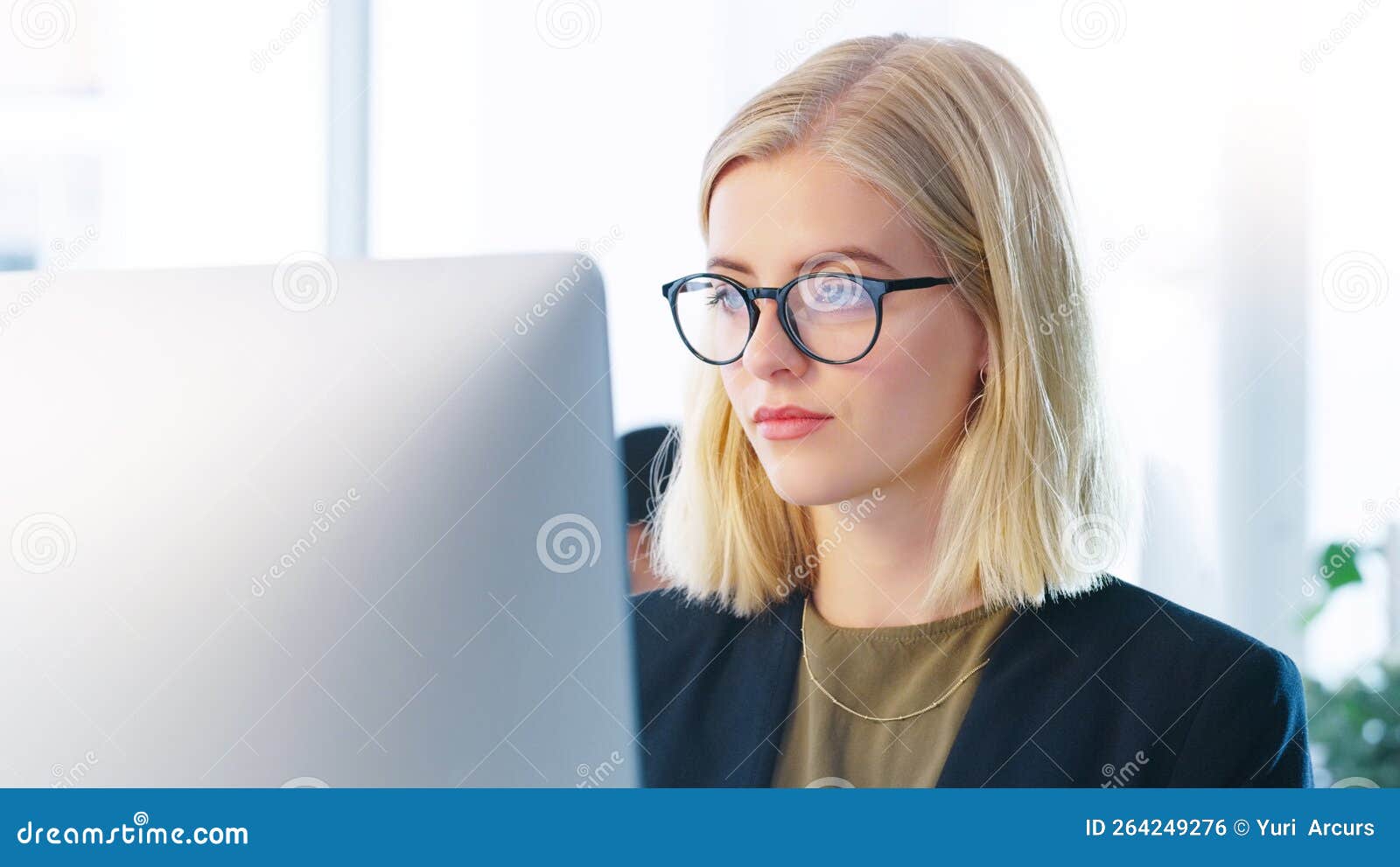 Working Hard and Looking Good. a Focused Young Businesswoman Working on ...