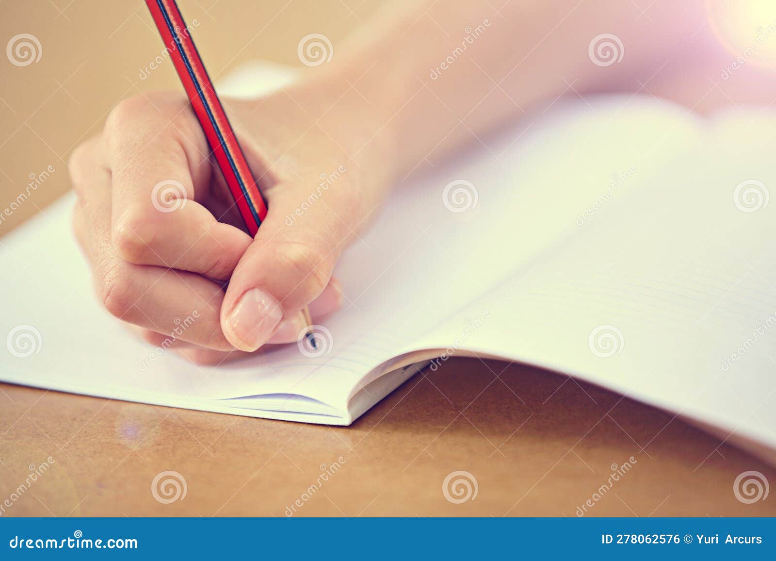 Working Hard at School. a Cropped Closeup Image of a Child Writing in a ...
