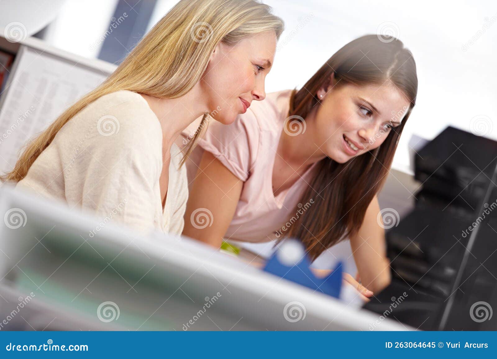Working Their Next Project. Two Female Coworkers Working in the Office ...