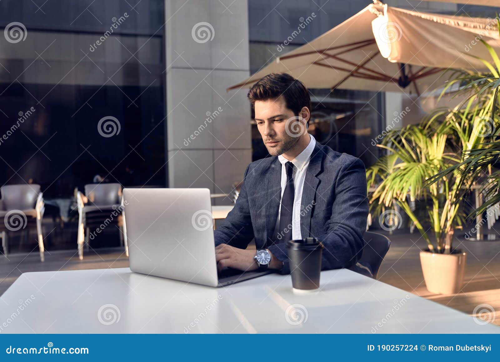 Working Hard To Achieve Success. Thoughtful Young Modern Man Using ...