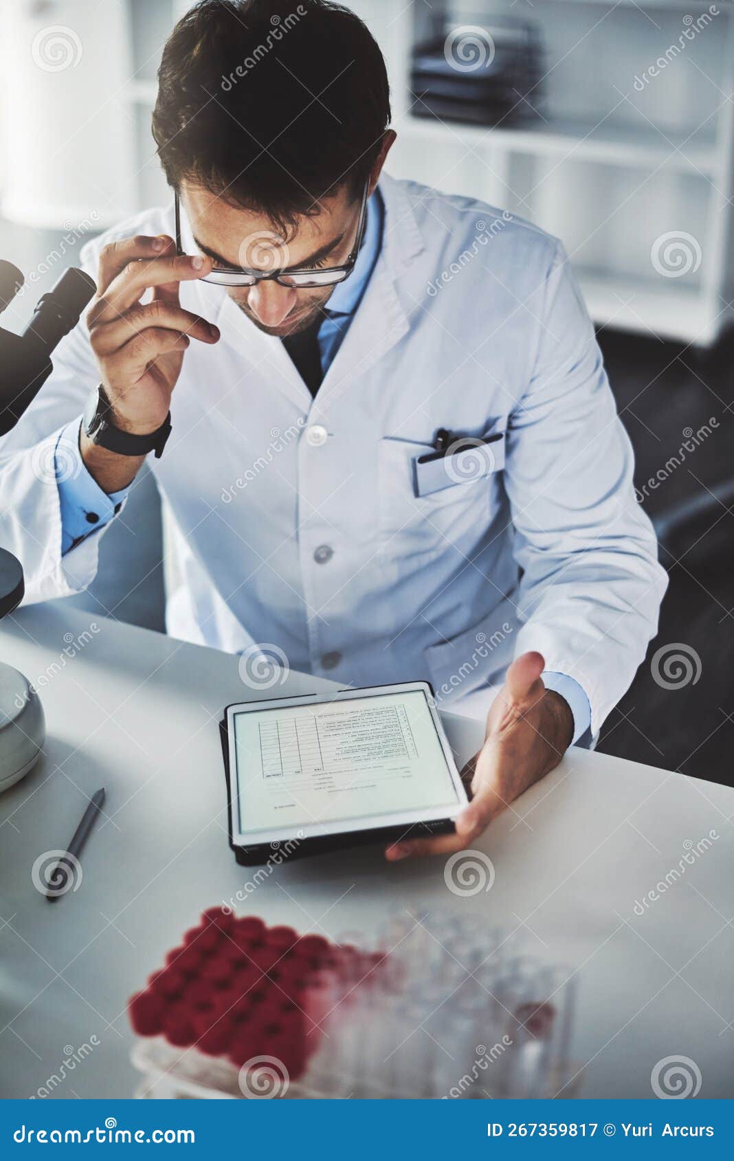 Working on His Latest Discovery. a Scientist Using a Digital Tablet ...