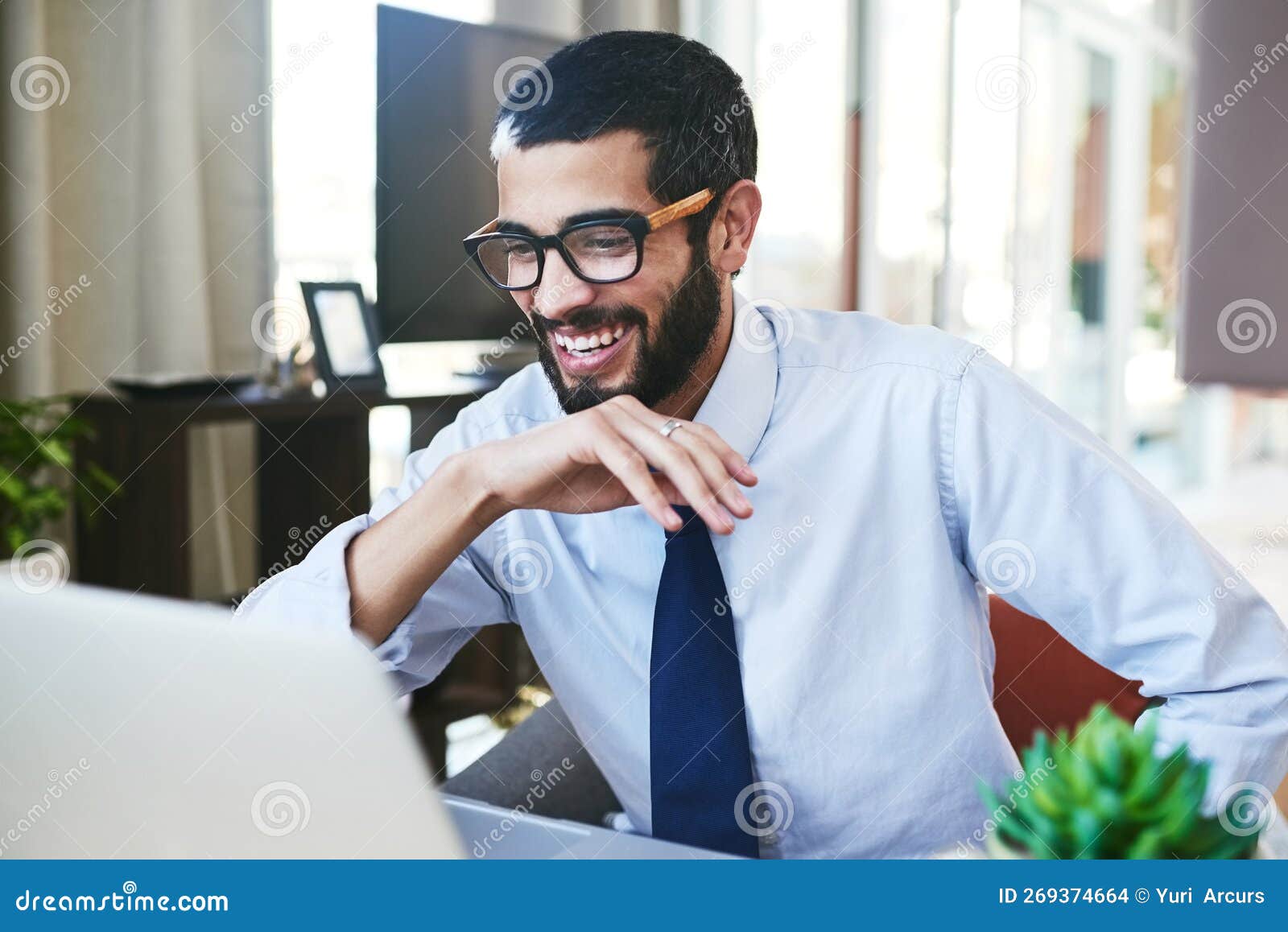 Working from Home Has Been Great. a Young Man Using His Laptop while ...