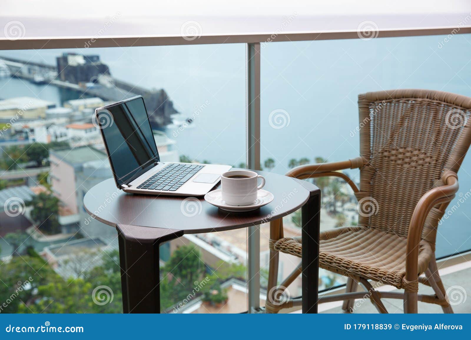 Working from Home. Workplace with Laptop and Cup of Coffee on Balcony ...