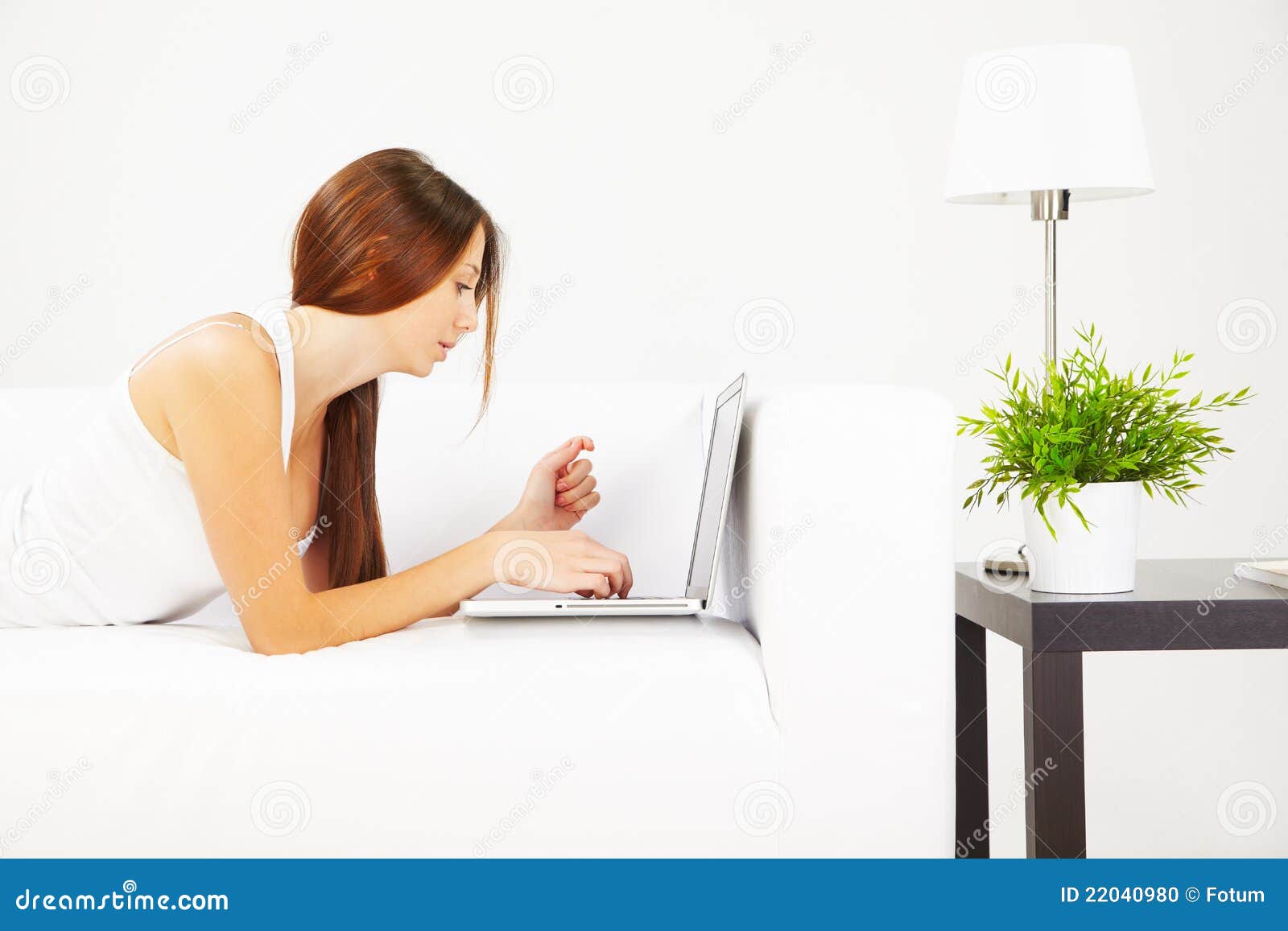 Working on laptop at home stock photo. Image of thinking - 22040980