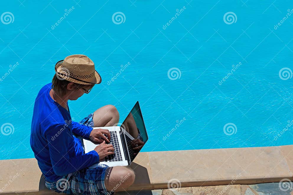 Working on Laptop at the Pool Stock Photo - Image of relax, bath: 33828554