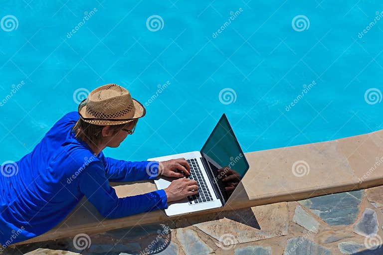 Working on Laptop at the Pool Stock Photo - Image of portable, hotel ...