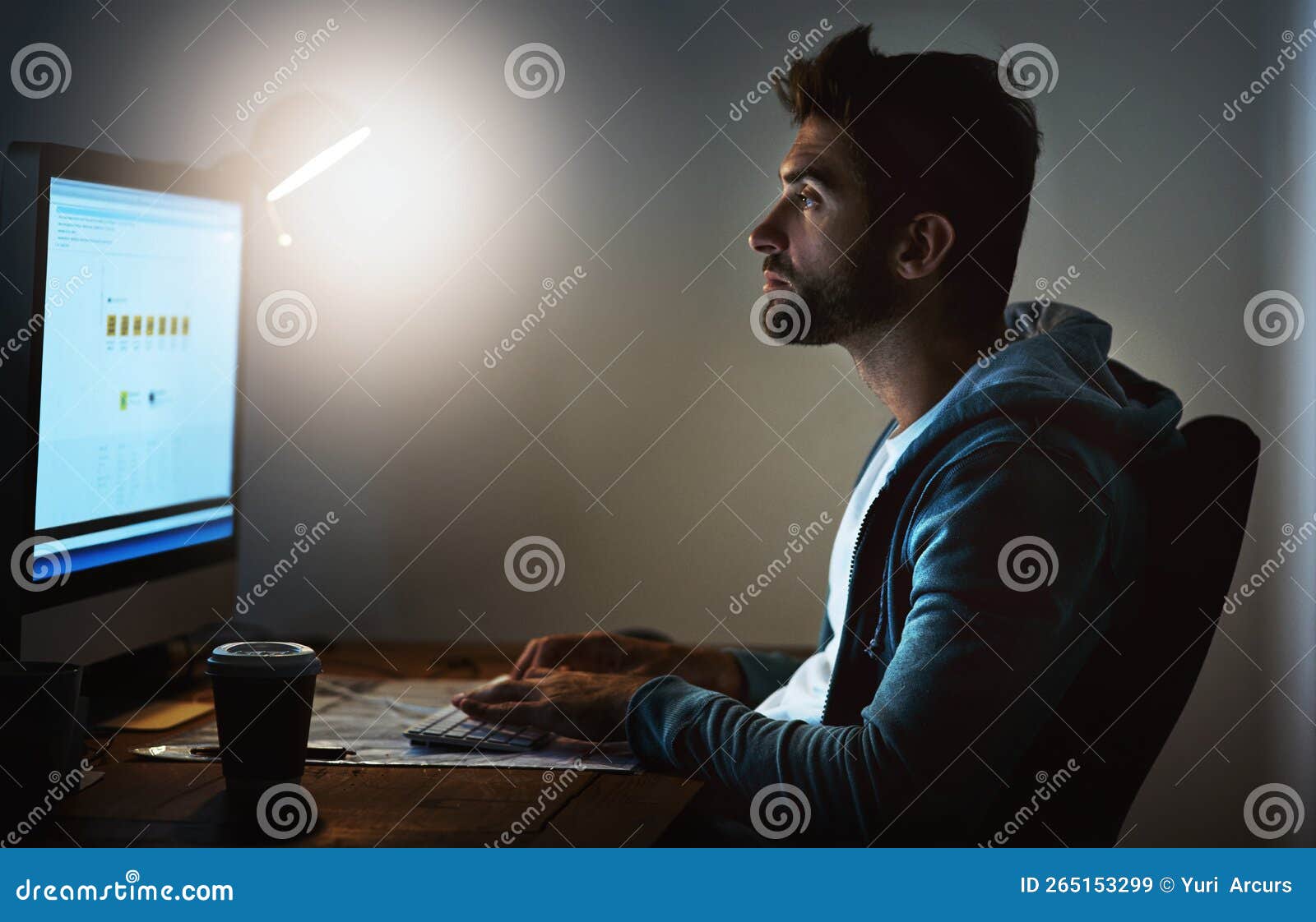 Working Late into the Night. a Young Designer Working Late in the ...