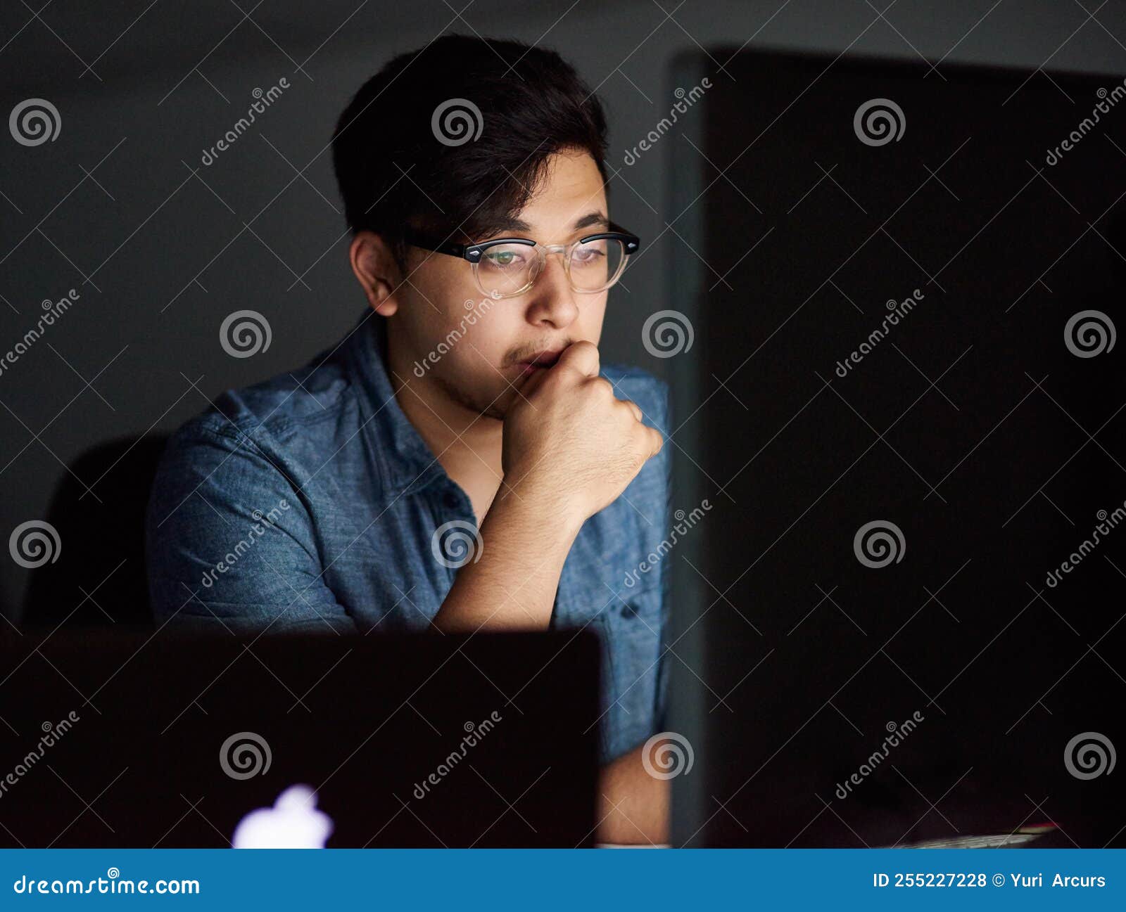 Working the Late Shift. a Young Man Working Late in His Office. Stock ...