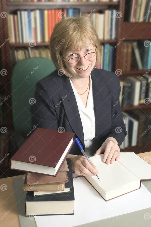 Working in the Library stock image. Image of cheeky, smile - 112583