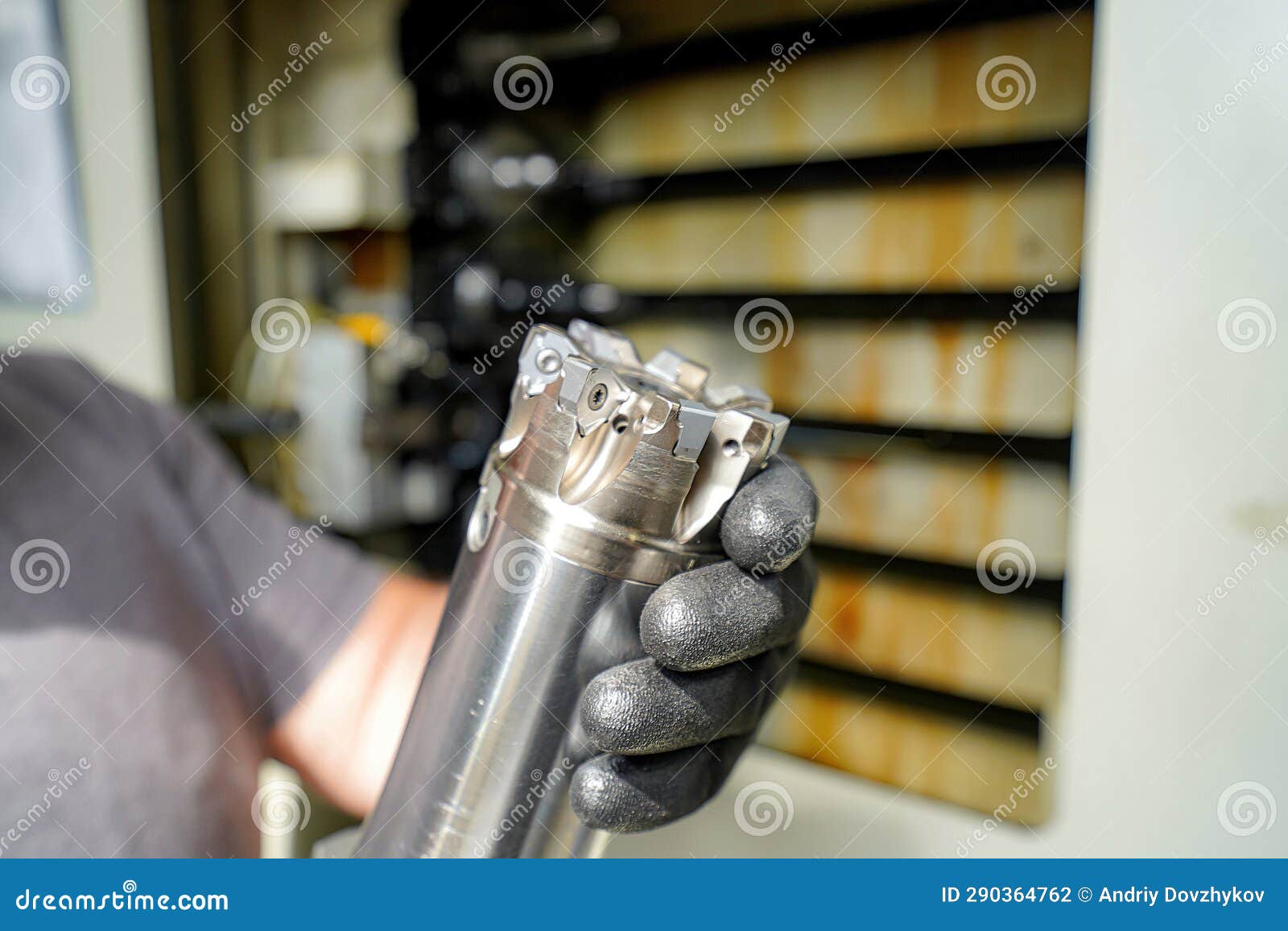 A Working Machine Operator Inspects and Changes a Cutting Tool in the ...