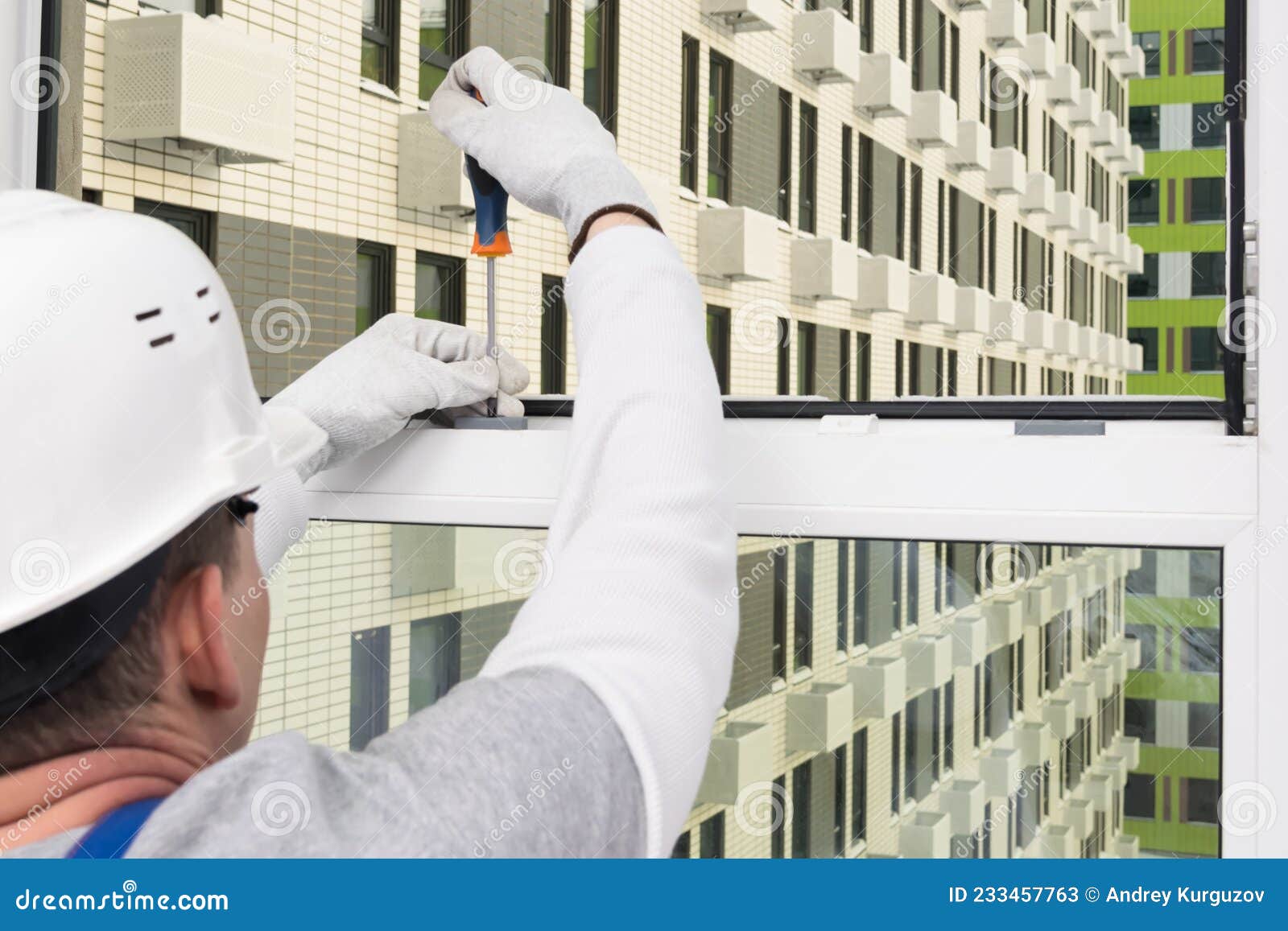 Working Man Installs Windows in the Apartment, Rear View Stock Image ...