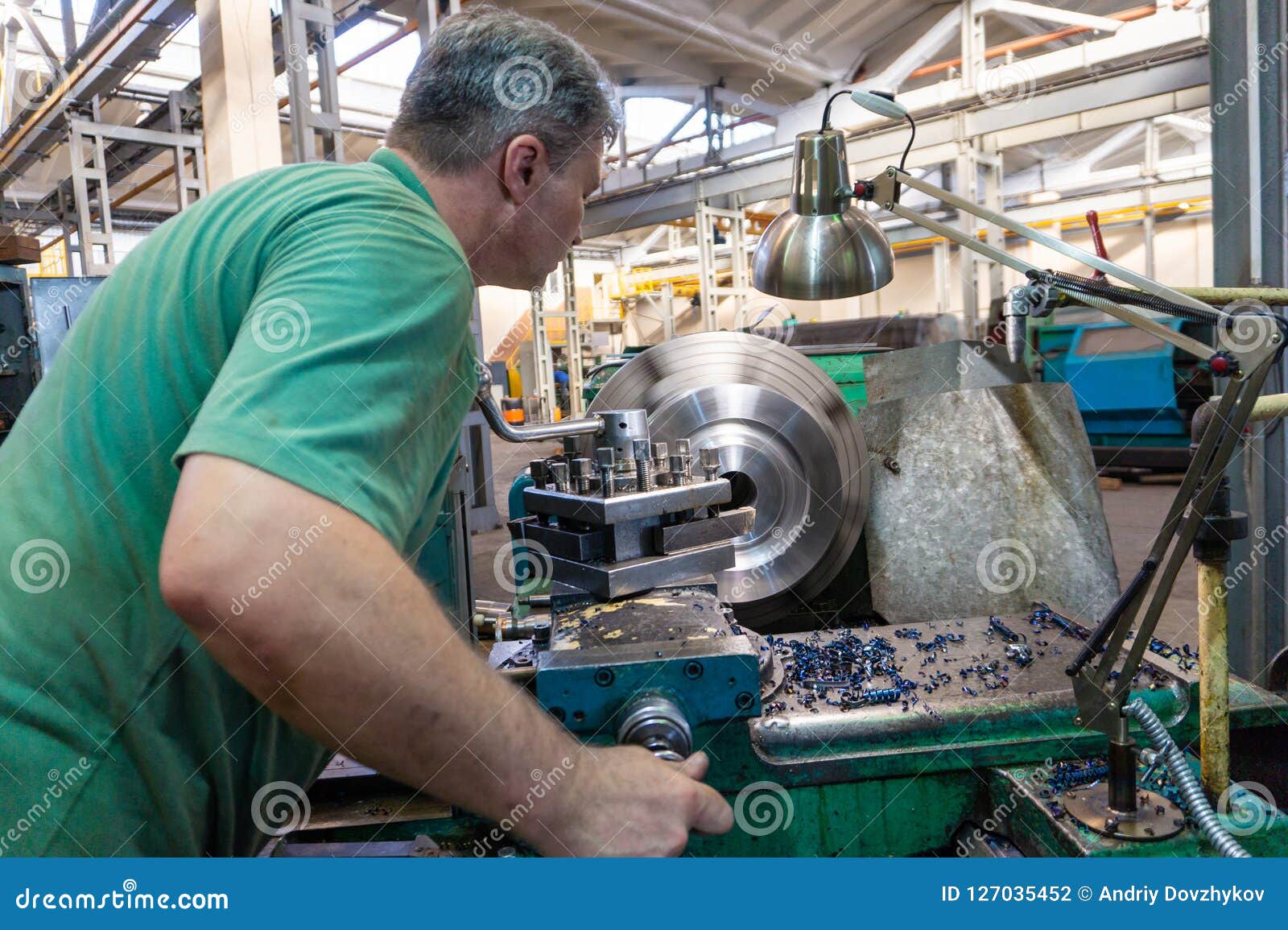 Working Man Manages The Equipment Of The Cutting Machine. Turning Work ...