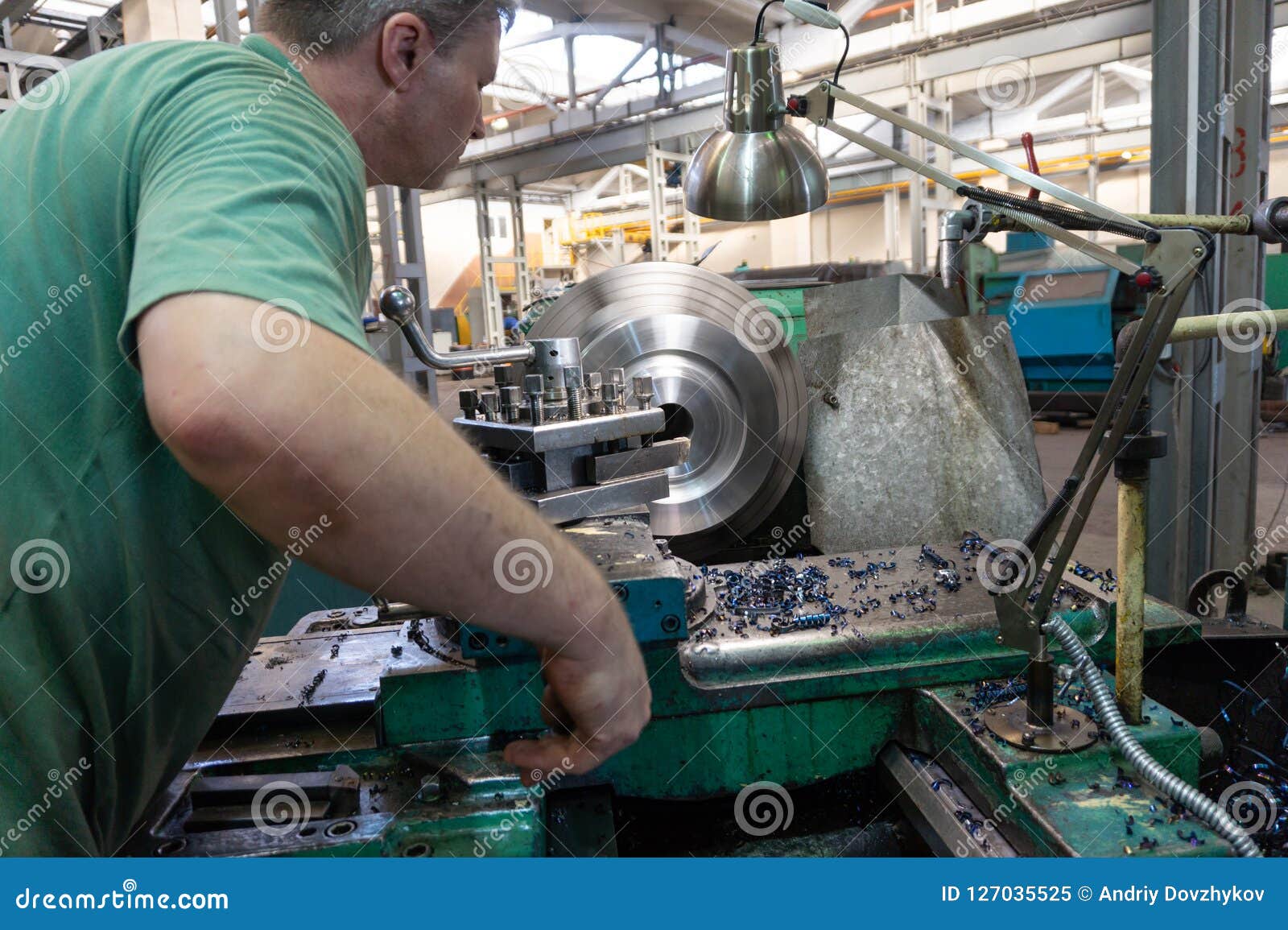 Working Man Manages the Equipment of the Cutting Machine. Turning Work ...