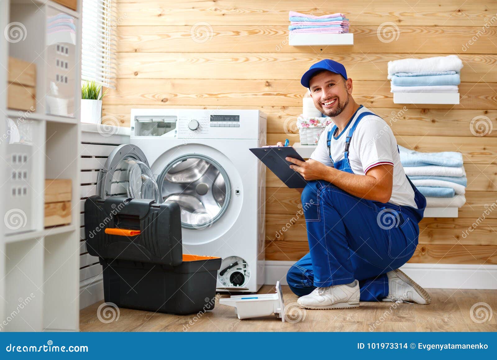 Working Man Plumber Repairs Washing Machine in Laundry Stock Photo ...